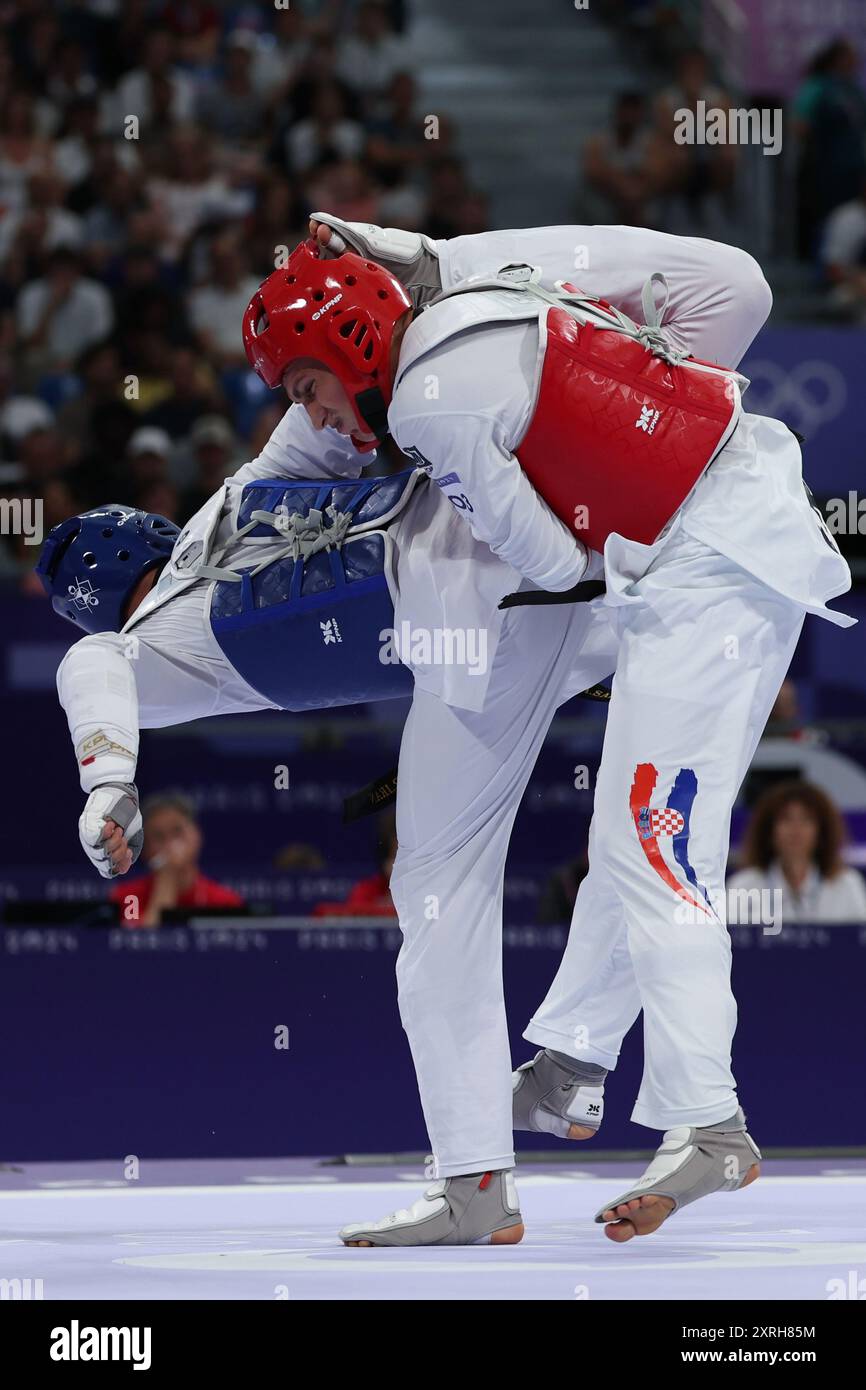 Paris, France. 10th Aug, 2024. Arian Salimi (in blue) of Iran competes ...