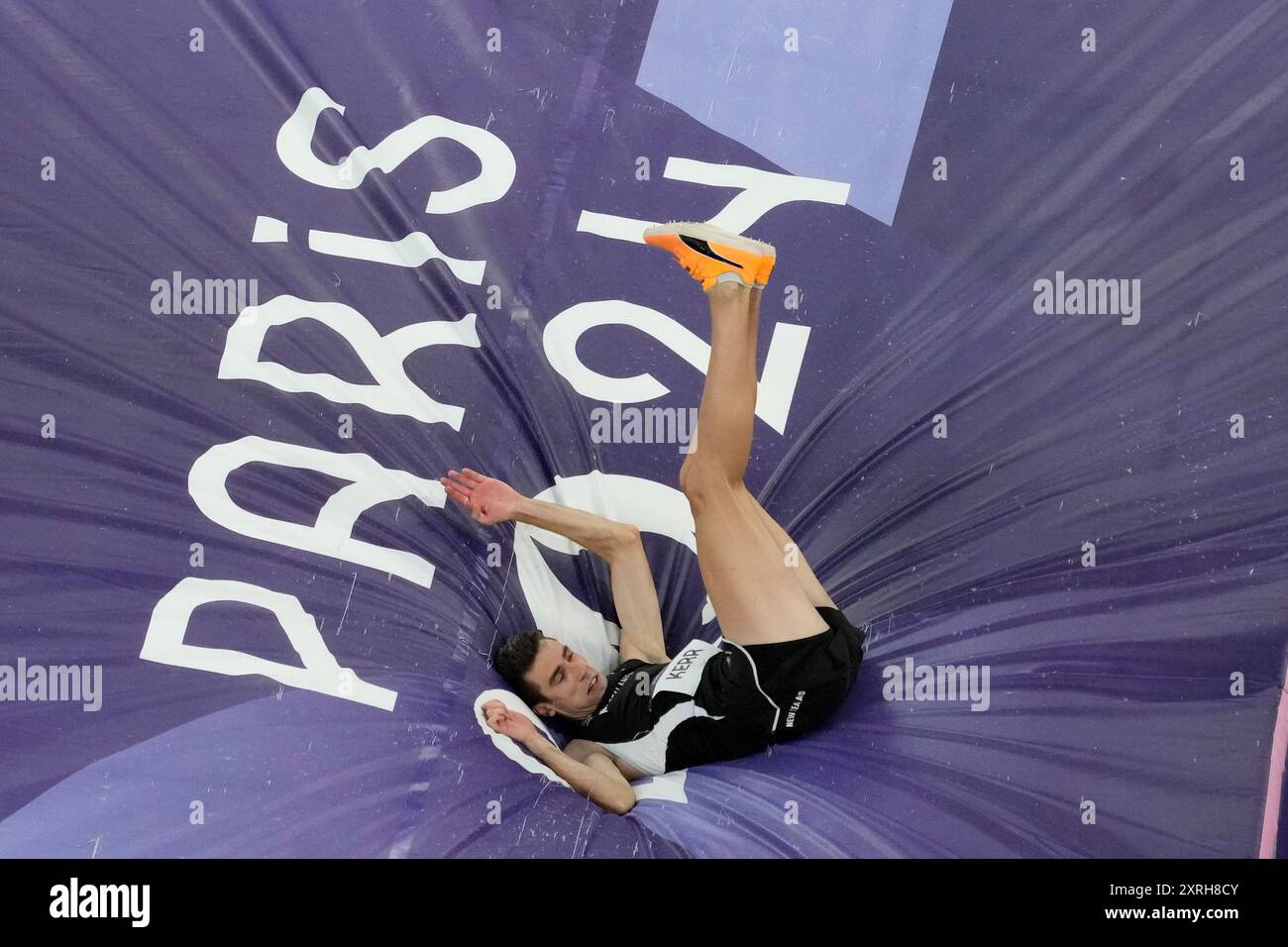 Hamish Kerr, of New Zealand, clears the bar to win the men's high jump ...
