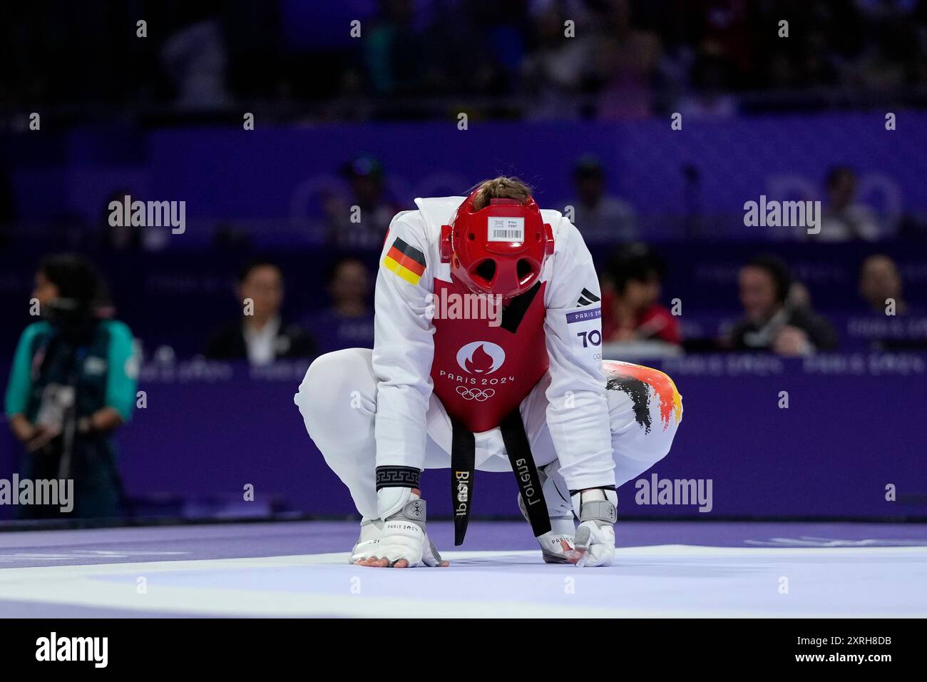 Germany's Lorena Brandl reacts after loosing in a women's over 67kg ...