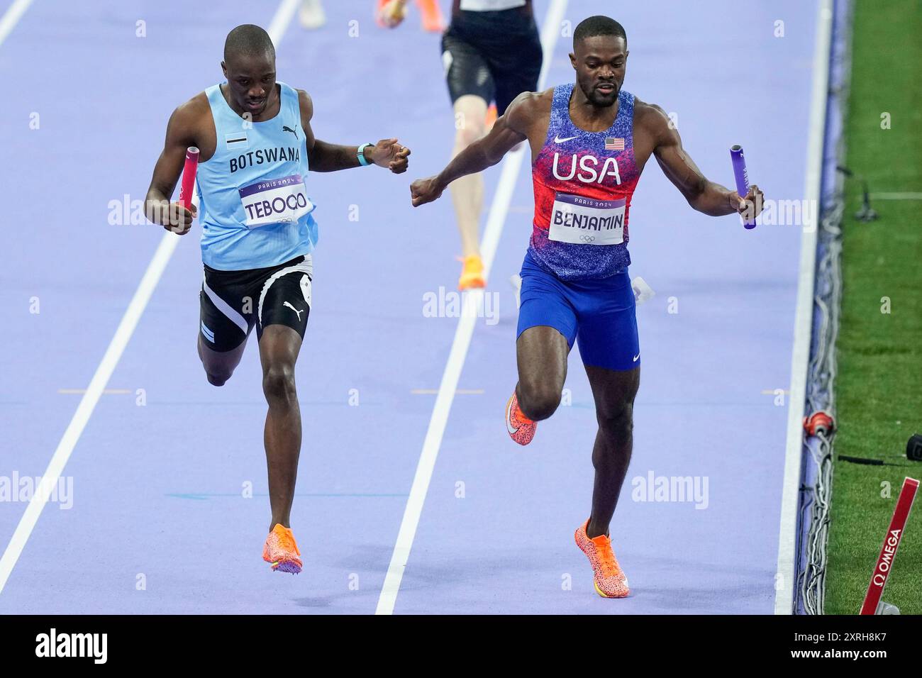 Rai Benjamin, of the United States, wins the men's 4 x 400-meter relay ...