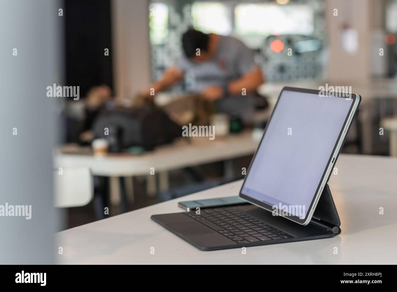 Computers on the desks are set up in the office to be available at all ...