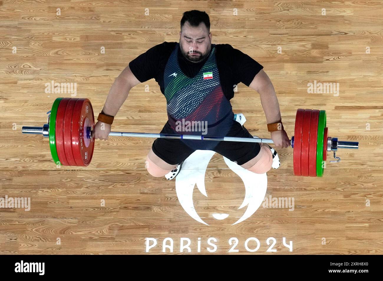 Ali Davaoudi of Iran competes during the men's +102kg weightlifting ...