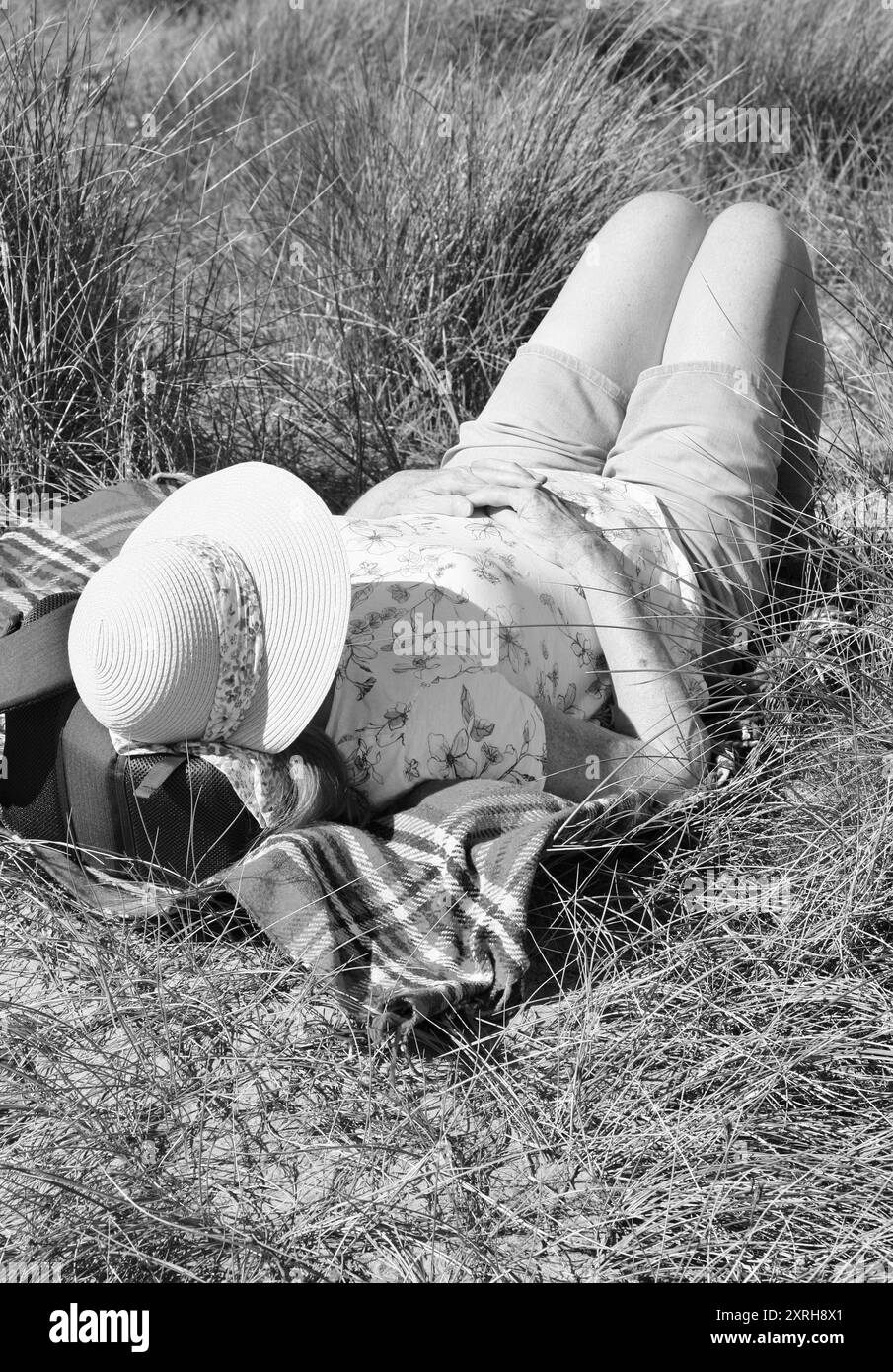 A senior lady, fast asleep in the summer sun Stock Photo - Alamy