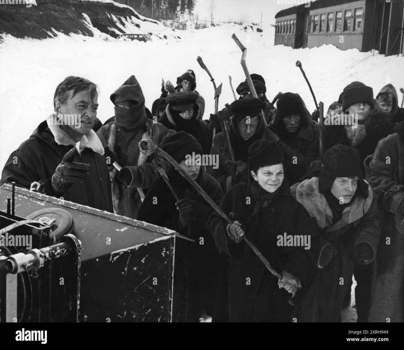 On location in Finland DAVID LEAN gives instructions to a group of ...