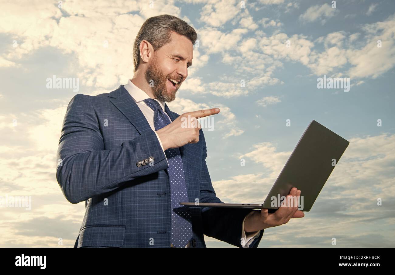 Smiling video blogger pointing hi-res stock photography and images - Alamy