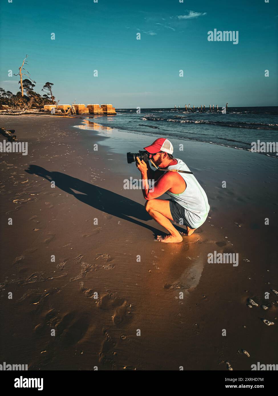 Attractive Male Photographer Capturing Sunset on Beach in Casual Attire ...