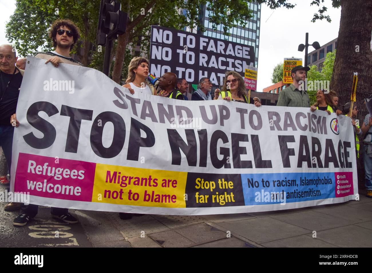 London, UK. 10th Aug, 2024. Protesters hold a 'Stop Nigel Farage ...