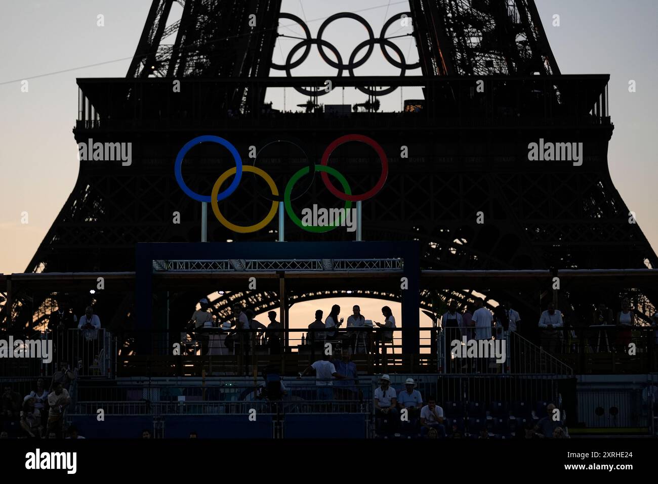 Spectators wait to watch the beach volleyball men's bronze medal match ...