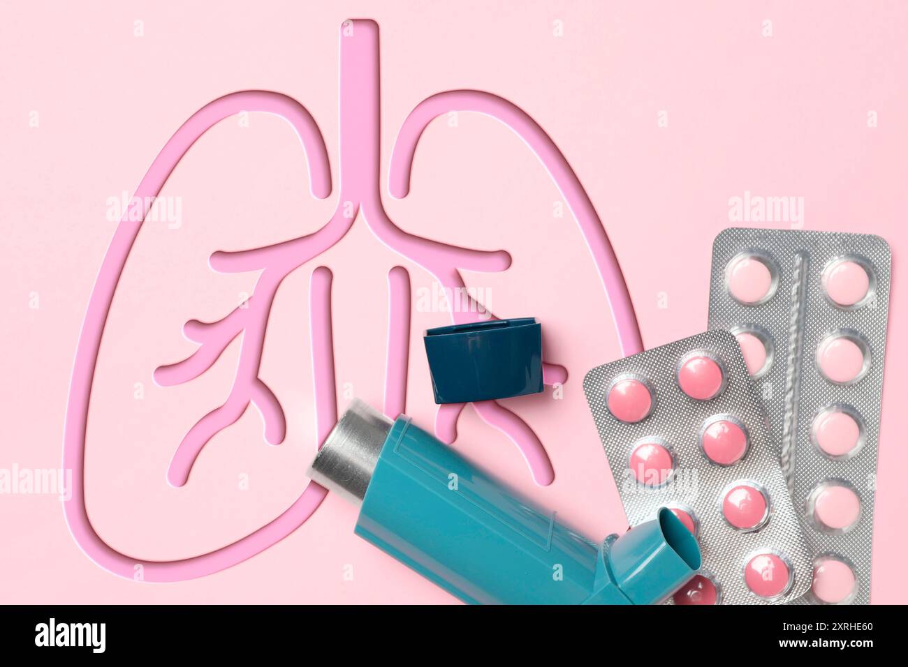 Asthma inhaler, drugs and illustration of lungs on pink background, top ...