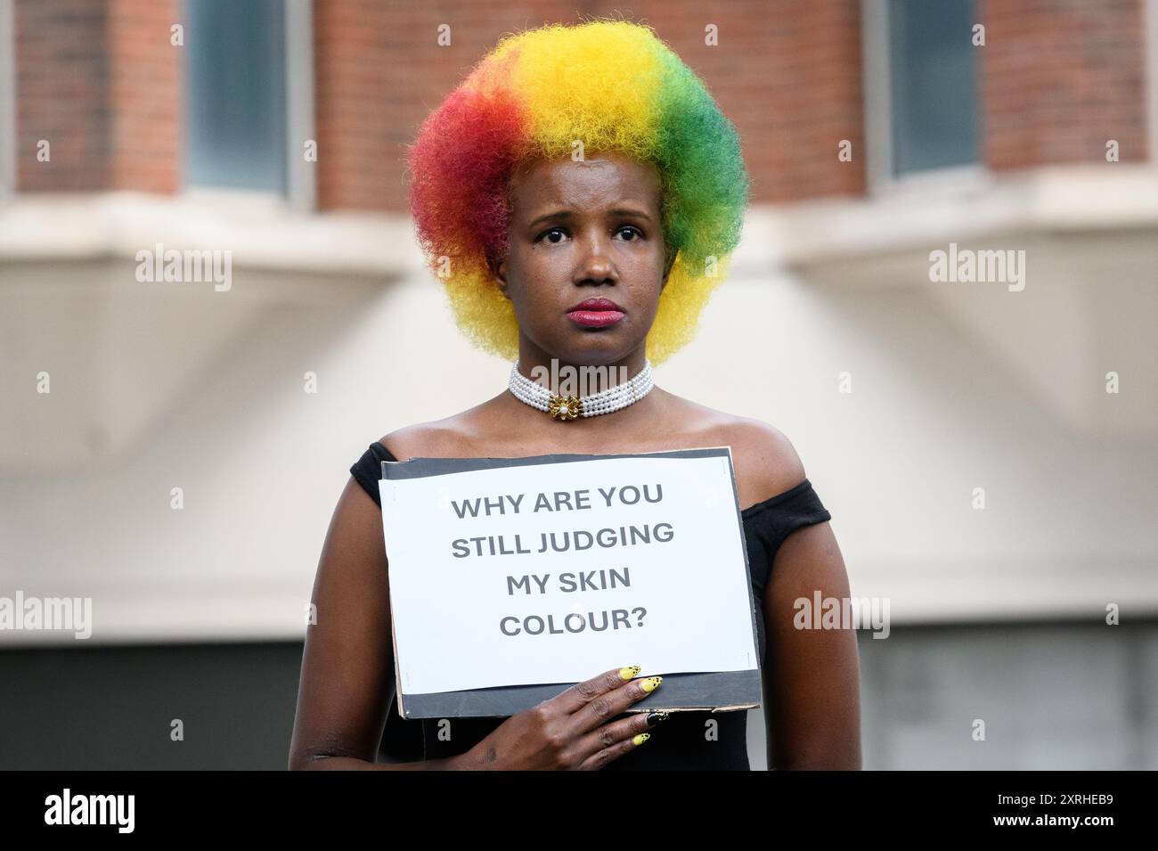 London, UK. 10 August, 2024. A woman with striking multi-coloured hair ...