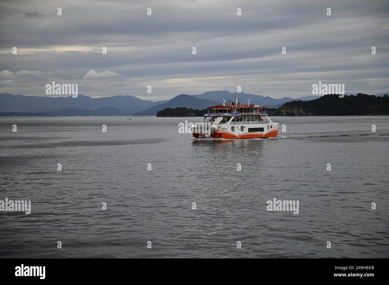 Landscape with scenic view of the JR West Miyajima Maru Ferry boat ...