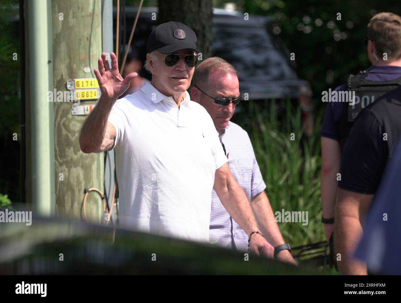President Joe Biden waves after a trip to the beach in Rehoboth Beach ...