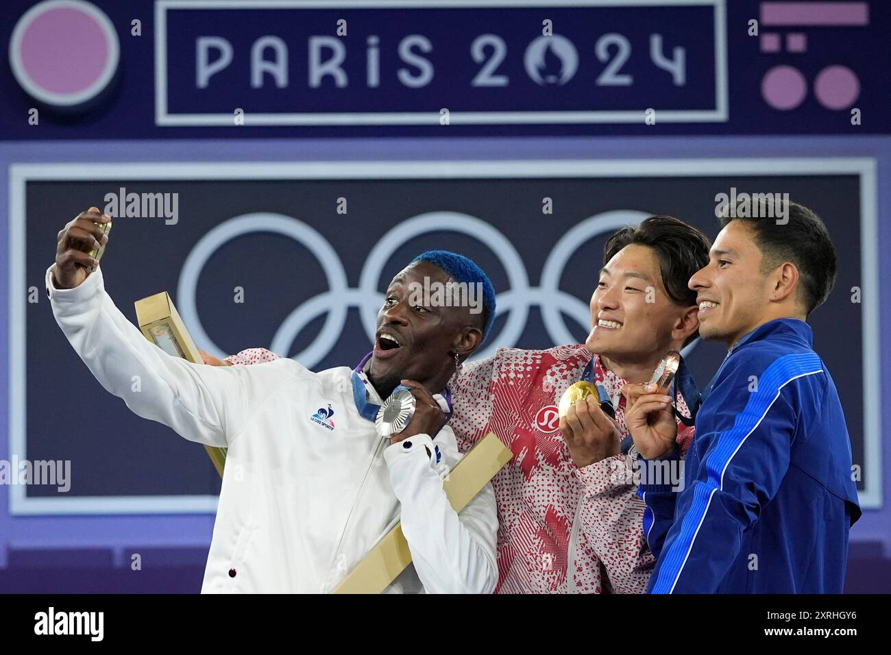 Gold medallist Canada's Philip Kim, known as B-Boy Phil Wizard, center ...