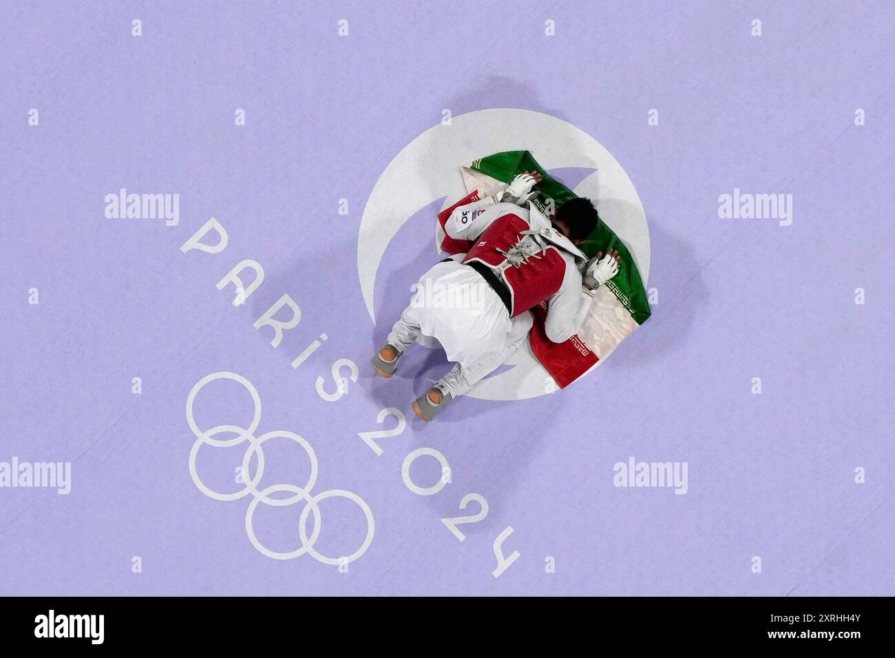 Iran's Arian Salimi celebrates after winning the gold medal in a men's ...