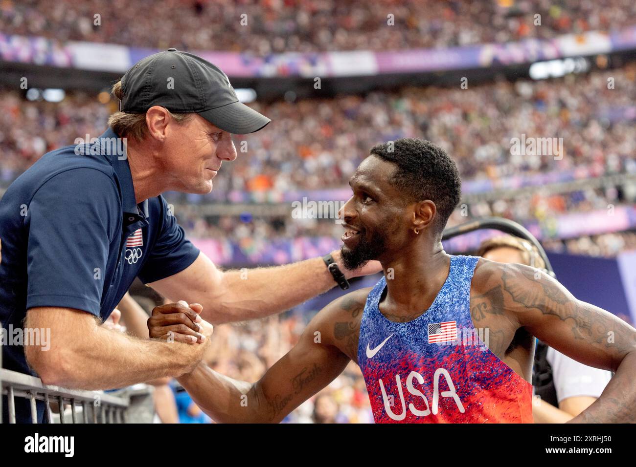 Shelby McEwen, of the United States, right, celebrates with his coach ...