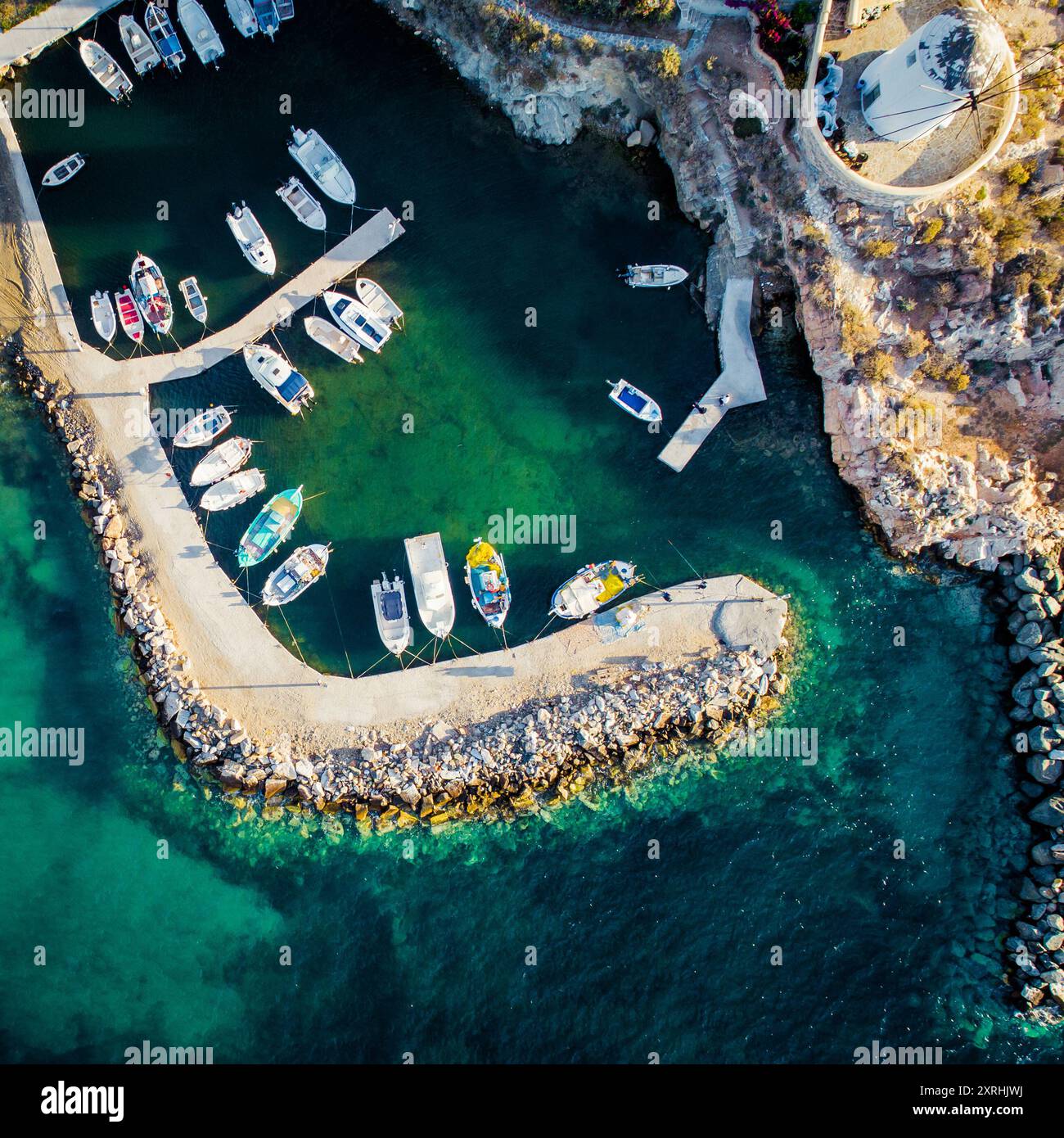 Aerial top view of small motorboats moored at dock, Paros island ...