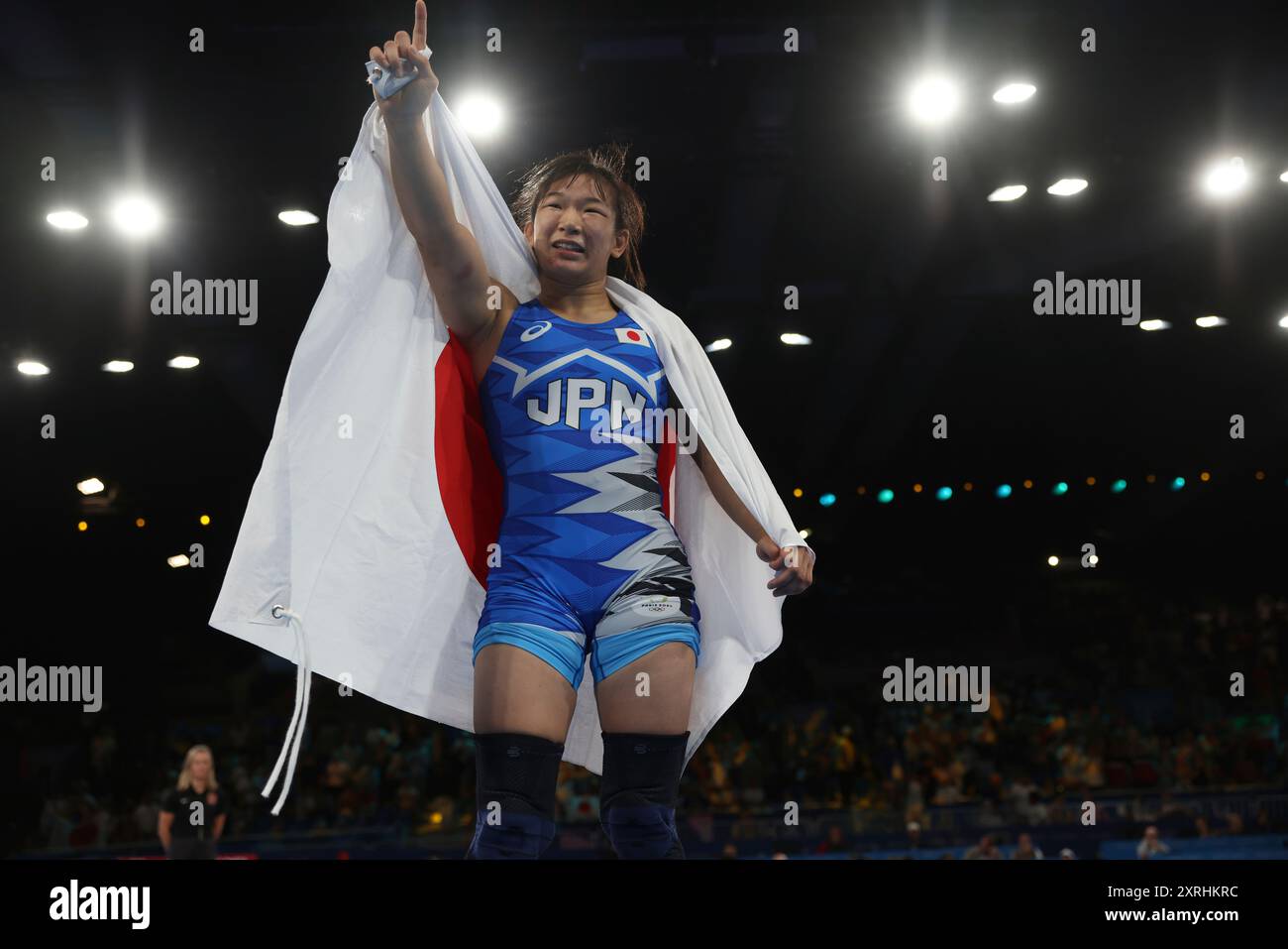 Japan's MOTOKI Sakura, wrapped in a Japanese national flag, celebrates ...