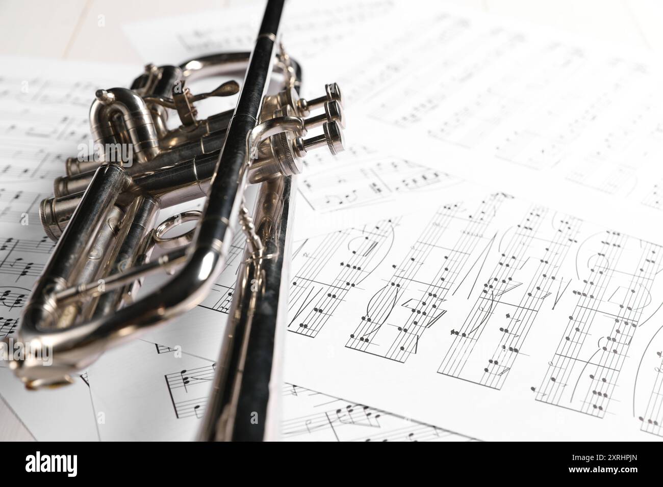Trumpet on music sheet papers with notes, closeup. Space for text Stock ...
