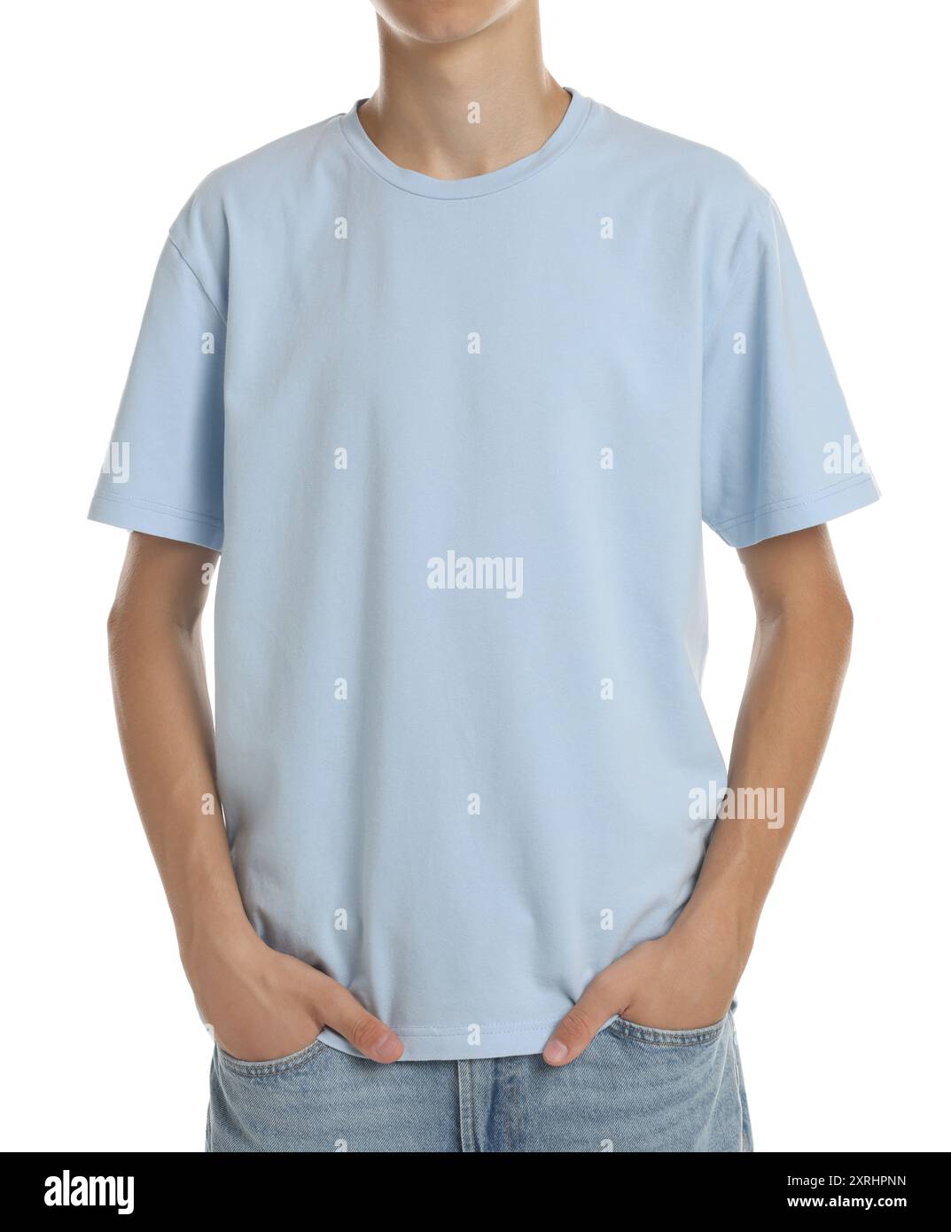 Teenage boy wearing light blue t-shirt on white background, closeup ...