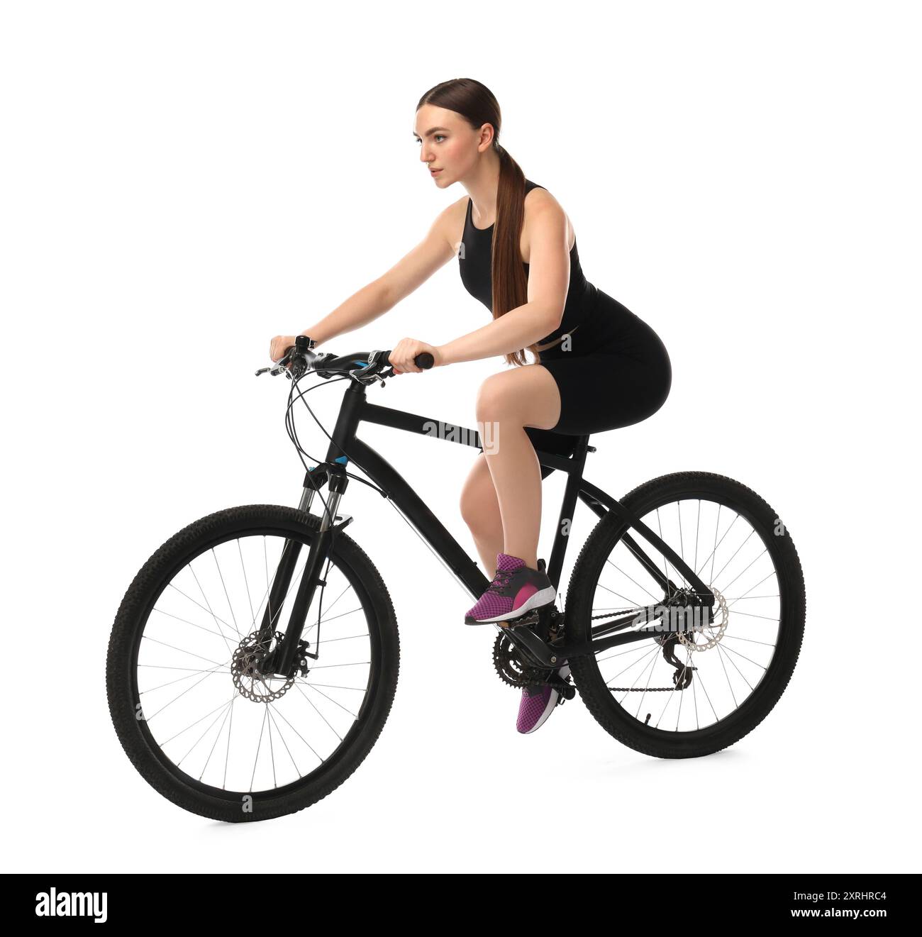 Beautiful young woman riding bicycle on white background Stock Photo ...