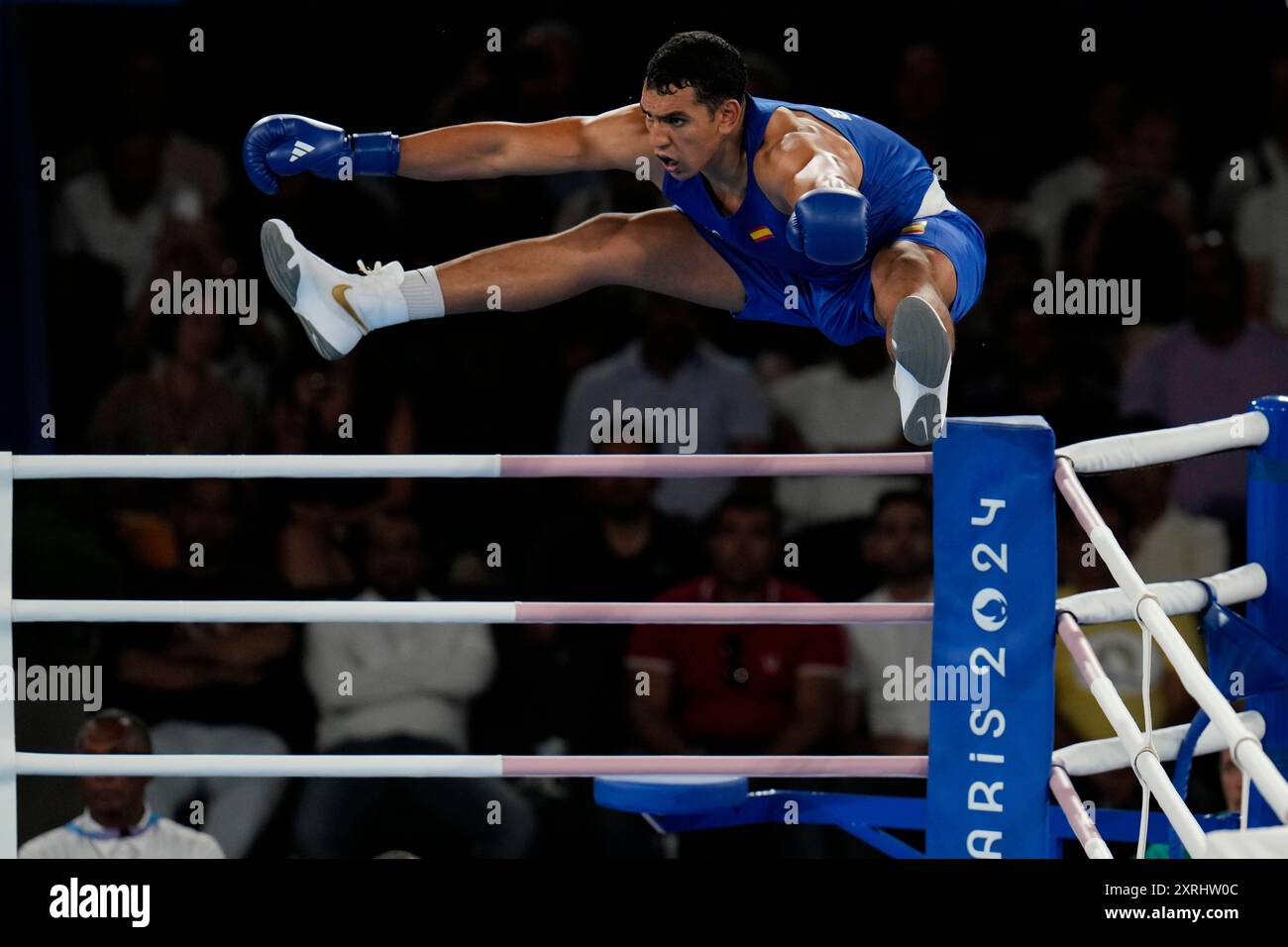 Spain's Ayoub Ghadfa warms up before fighting Uzbekistan's Bakhodir ...