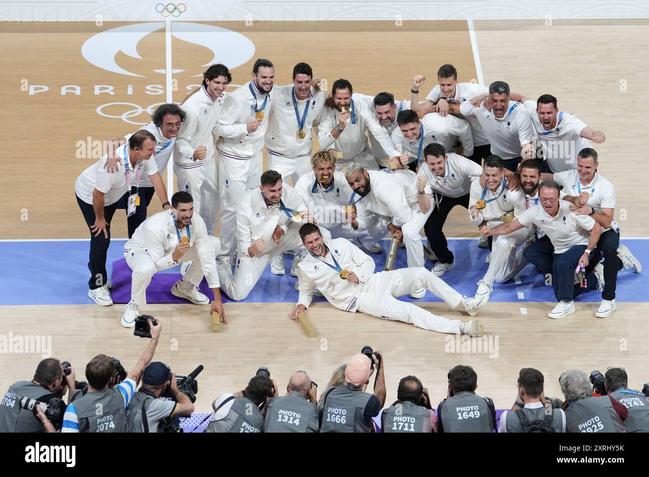 Paris, France. 10th Aug, 2024. Gold medalists team France pose for photos after the victory ...