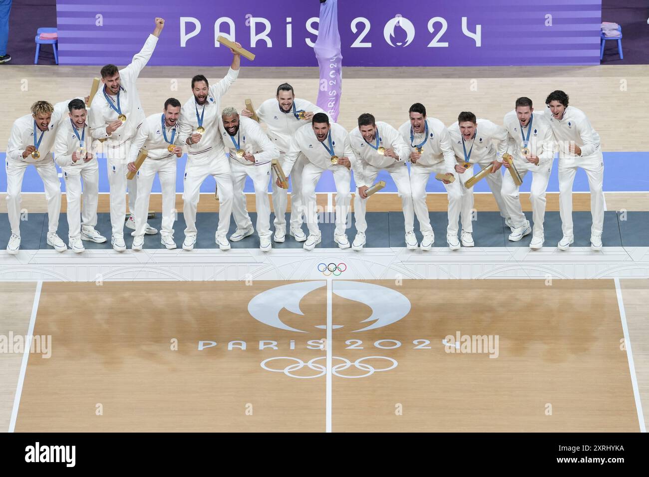 Paris, France. 10th Aug, 2024. Gold medalists team France pose for photos after the victory ...
