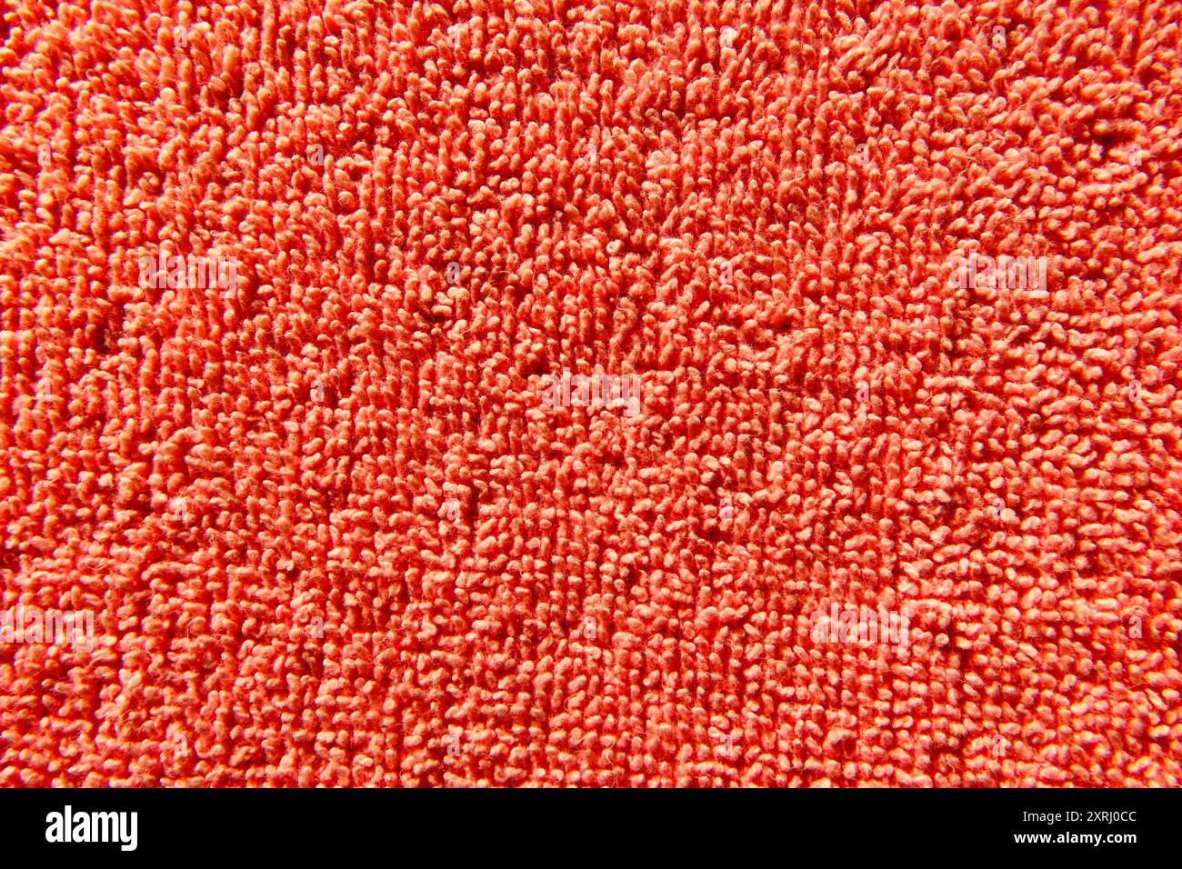 Soft pink fabric texture fills the frame, showcasing its rich, fluffy ...