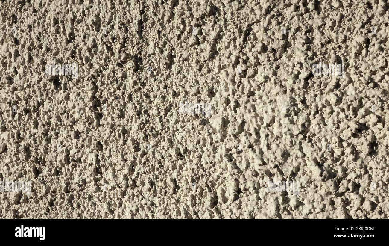 Close-up view of a textured plaster wall showing its unique patterns ...