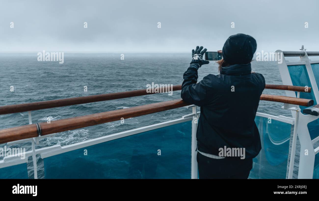 Antarctica Cruise Ship Passenger with Mobile Phone Takes Photo of A23a ...