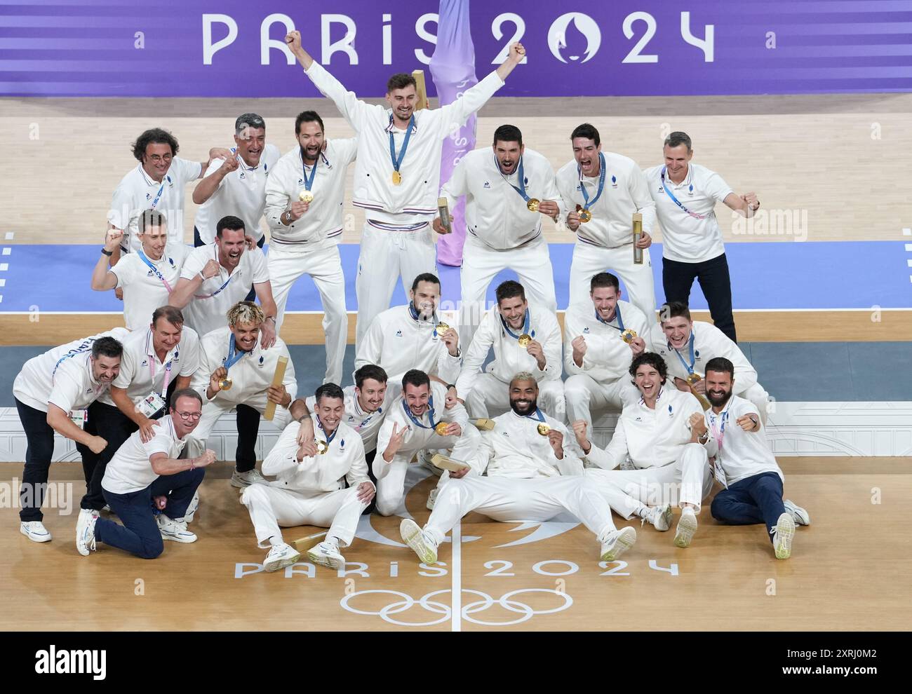 Paris, France. 10th Aug, 2024. Gold medalists team France pose for photos after the victory ...