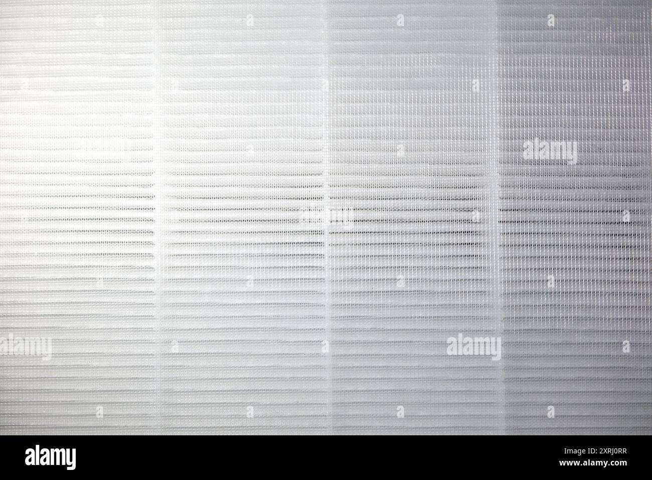 A textured background features a delicate grid with variations in tone ...