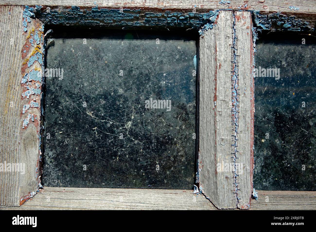 Detailed view of a rustic barn window with aged wood and dusty glass ...