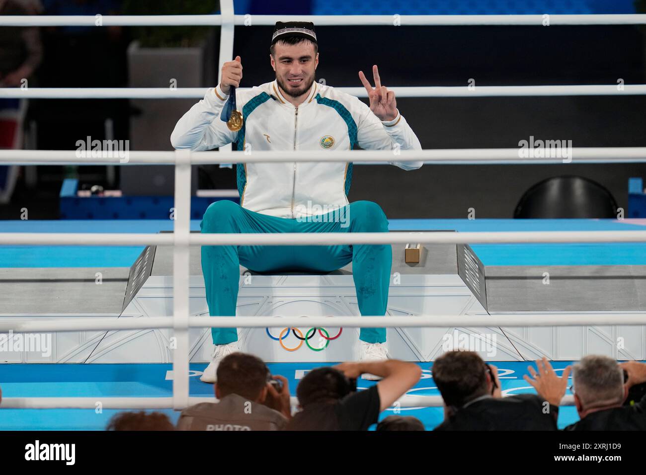 Gold medalist Uzbekistan's Bakhodir Jalolov poses during a medals ...