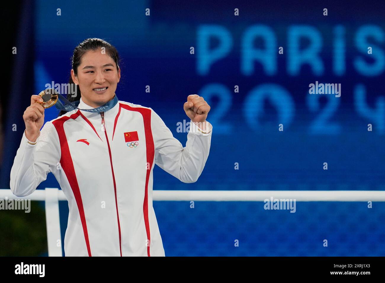 Gold medalist China's Li Qian poses during a medals ceremony for the ...