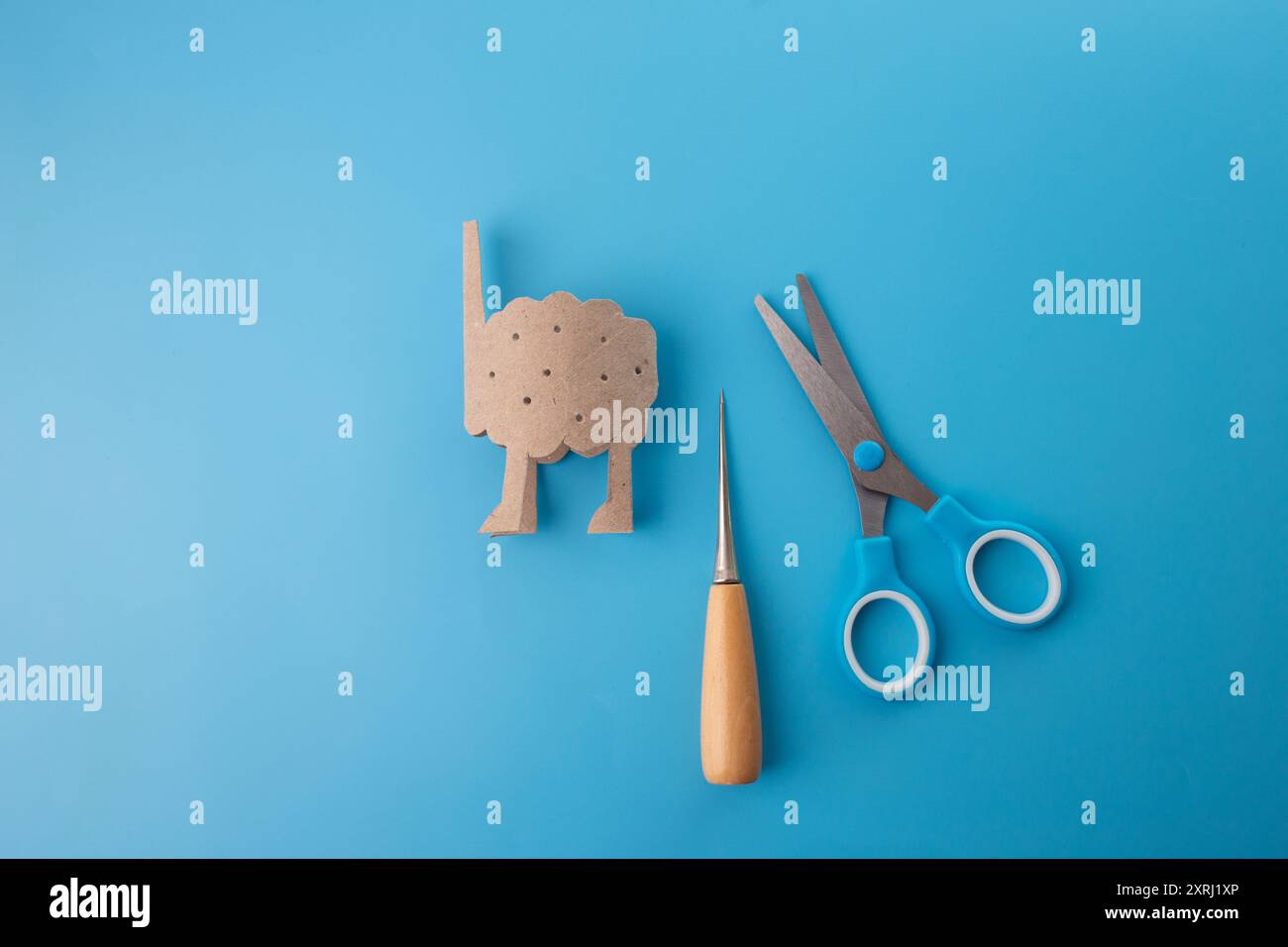 Top view of a craft detail, cut-out from a toilet paper roll pierced ...