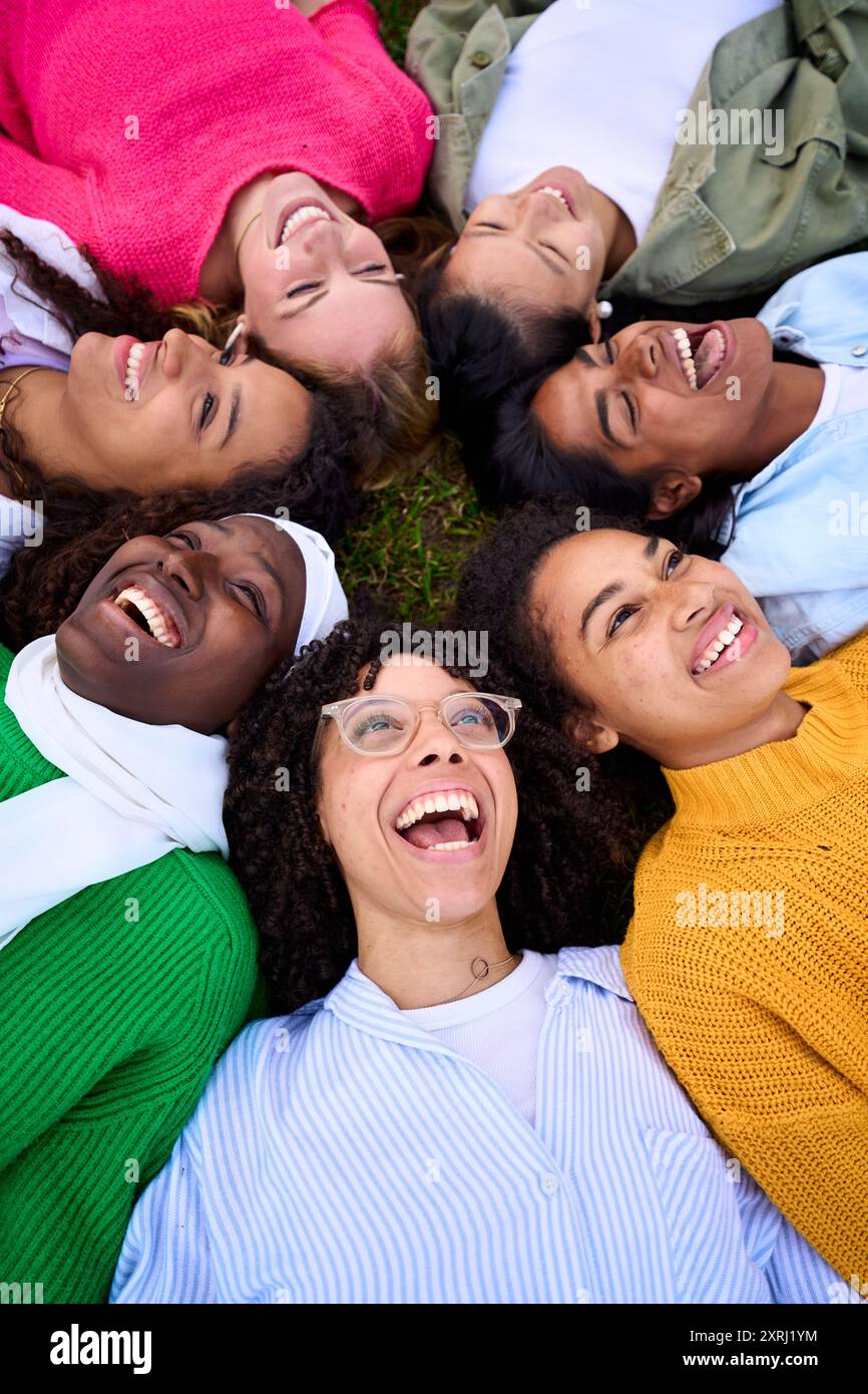 Multiracial group of young only female community friends having fun ...