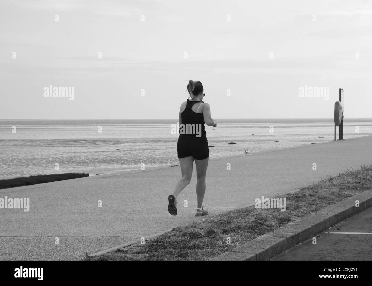 Lady running along promenade hi-res stock photography and images - Alamy