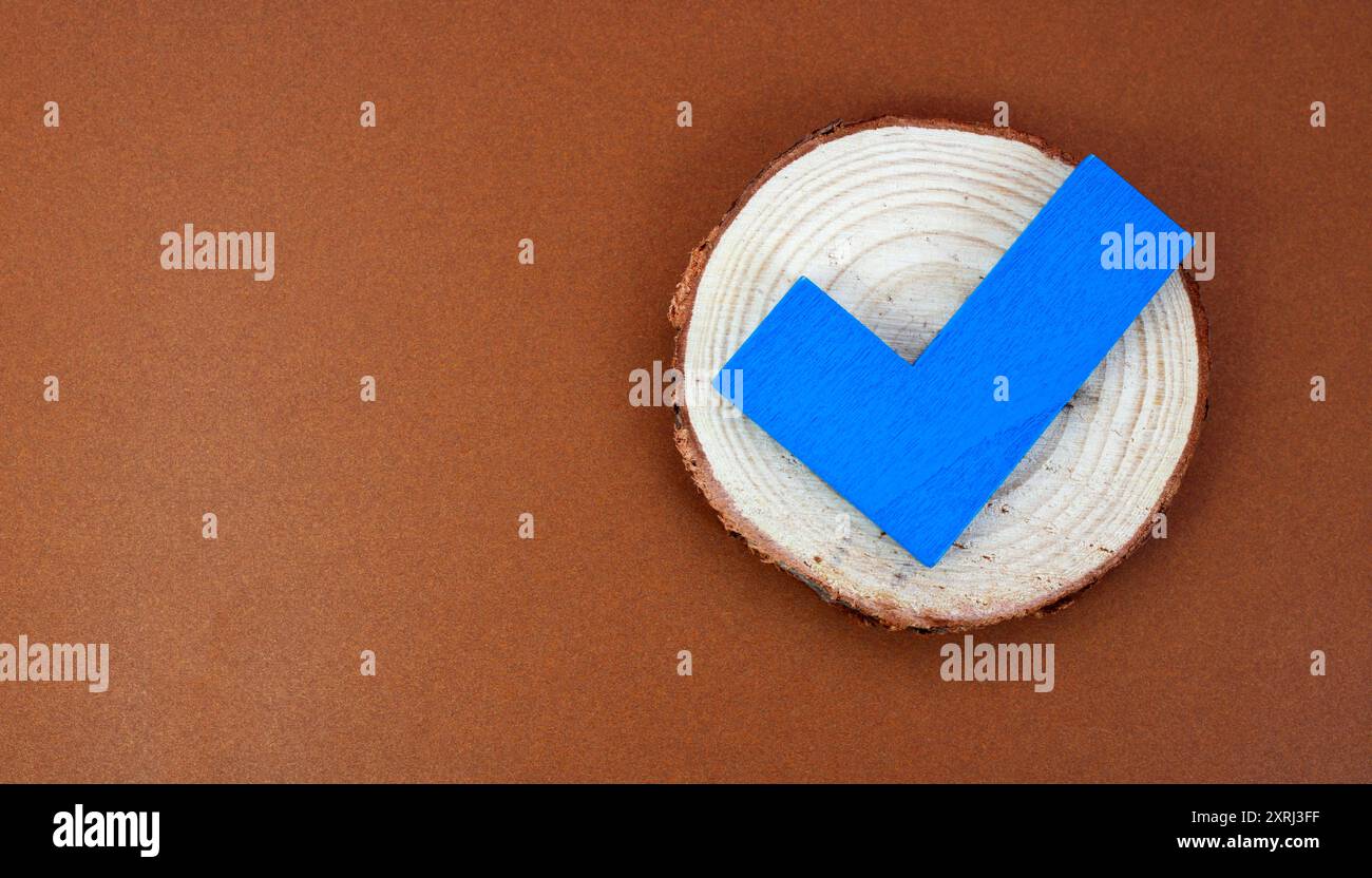 Wooden Check Mark inside circle of the same material Stock Photo - Alamy