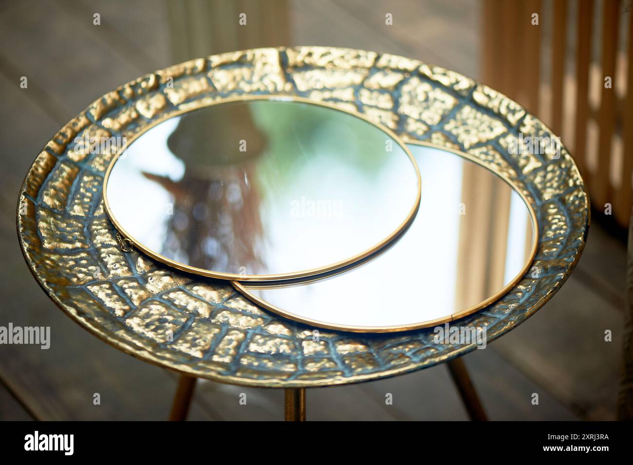 Round mirror in a golden frame. With the reflection of the sky. Beauty ...