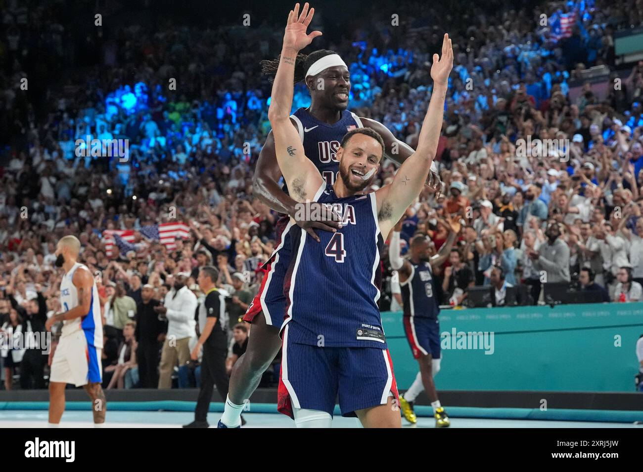 Jrue Holiday (12) and Stephen Curry (4) celebrate after team USA ...
