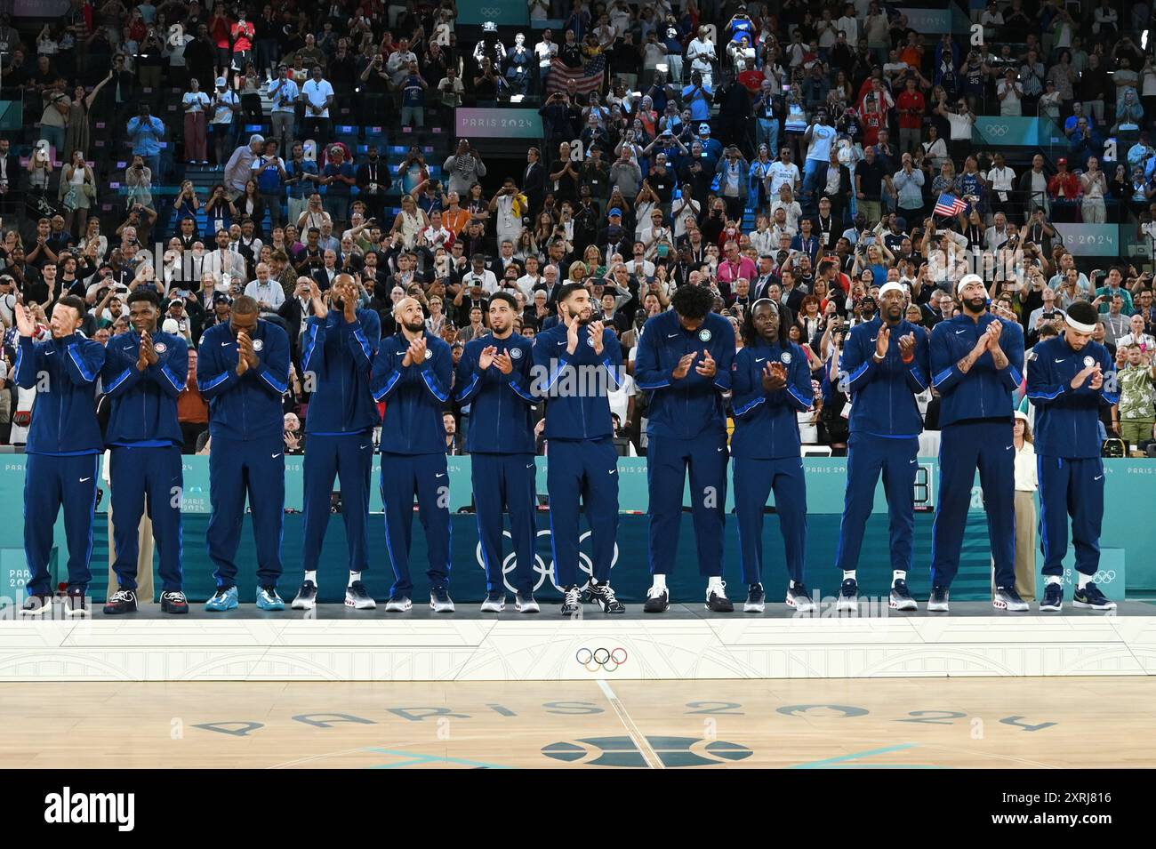 Paris, Fra. 11th Aug, 2024. Team USA Basketball players stand on the ...