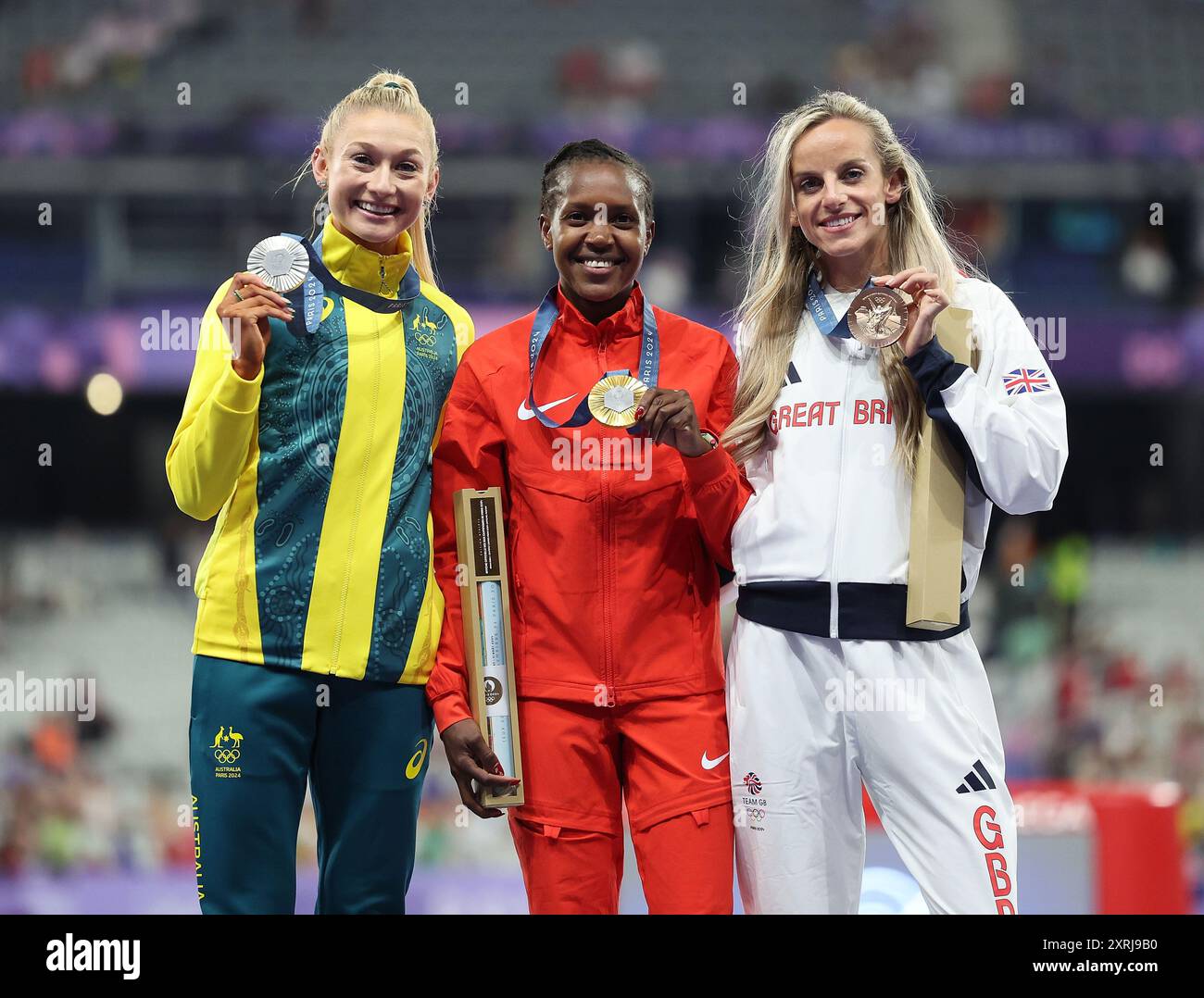 Paris, France. 10th Aug, 2024. Gold medalist Faith Kipyegon (C) of ...