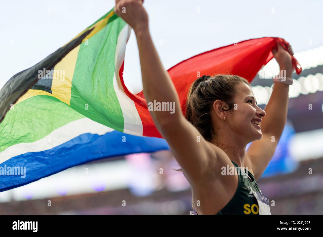 Jo-Ane van Dyk, of South Africa, takes a victory lap after winning the ...