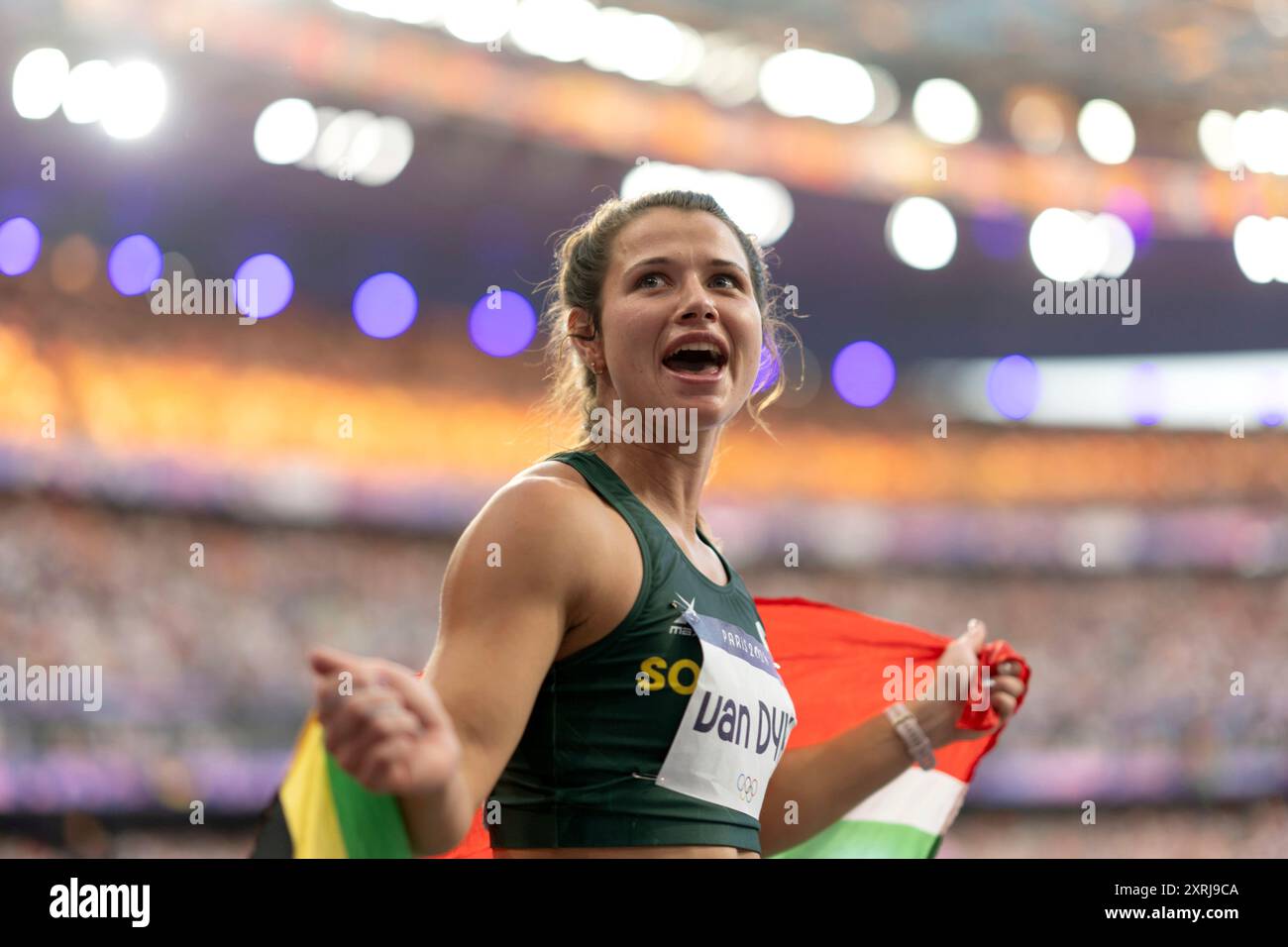 Jo-Ane van Dyk, of South Africa, takes a victory lap after winning the ...