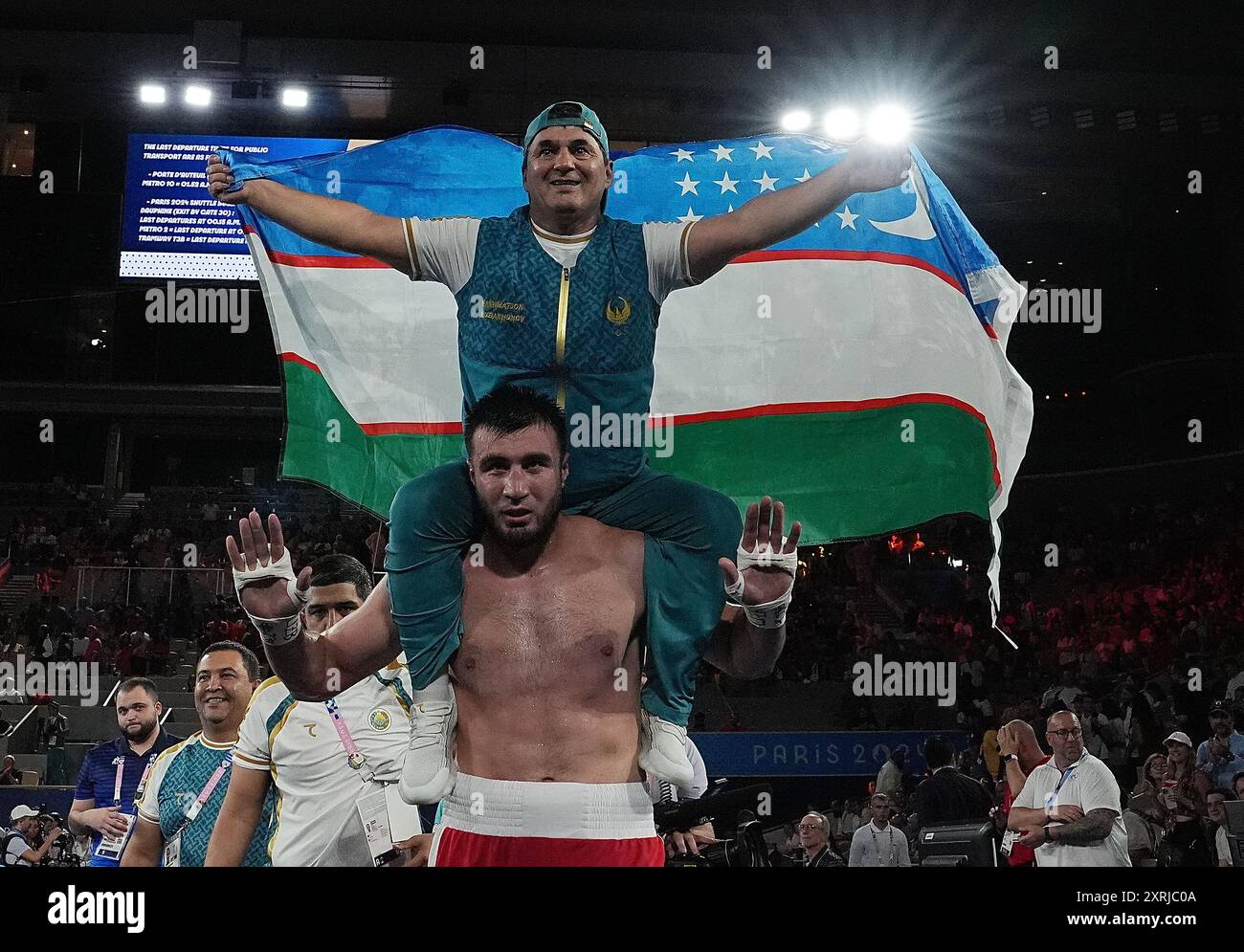 Paris, France. 10th Aug, 2024. Bakhodir Jalolov (bottom) of Uzbekistan ...