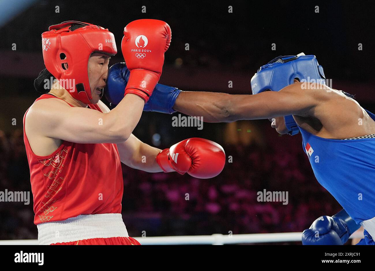 Paris, France. 10th Aug, 2024. Li Qian (in red) of China competes with ...