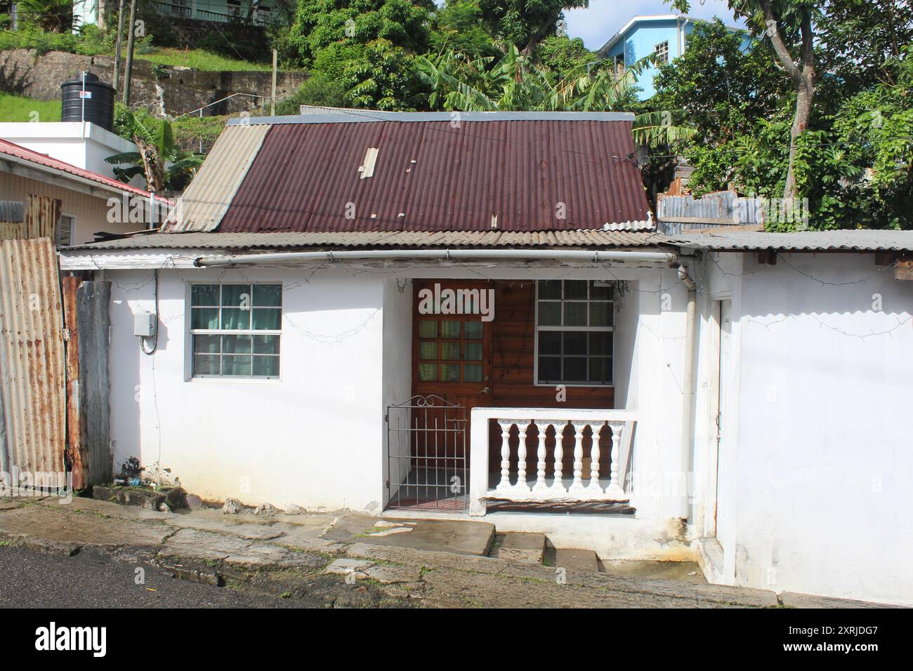Small white home with a fiberglass corrugated roof in Castries, Saint ...