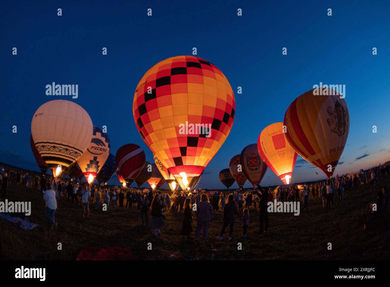 Moscow, Russia. 9th Aug, 2024. Hot-air balloons are illuminated during ...