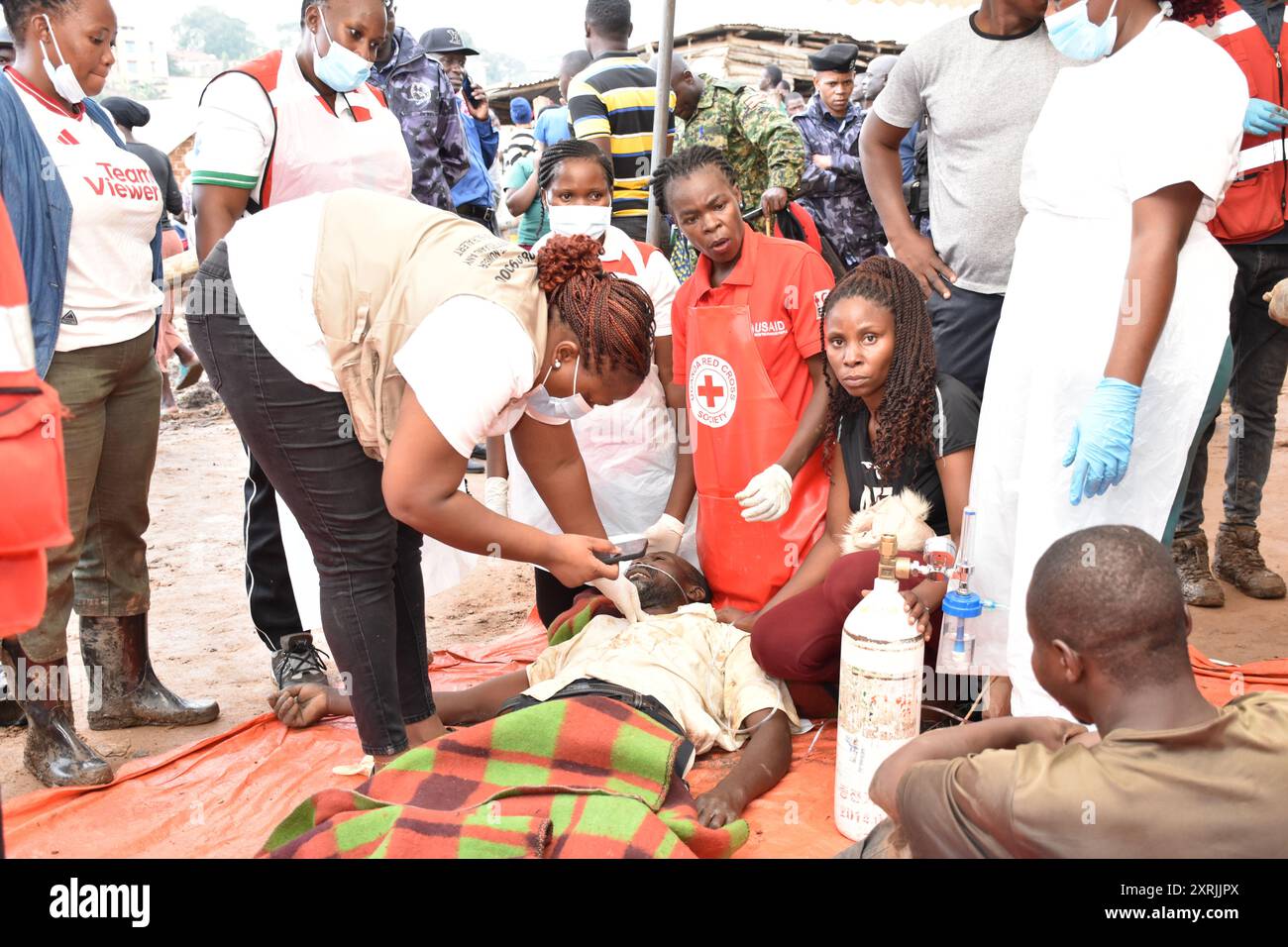Wakiso, Wakiso. 10th Aug, 2024. Humanitarian workers treat one of the ...
